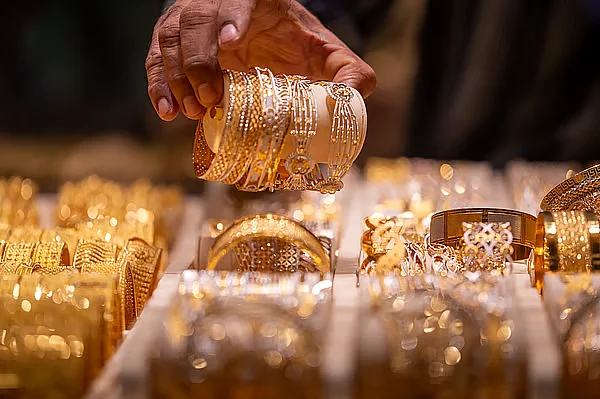 Indian gold, silver futures jump to record high amid rupees' all-time ...