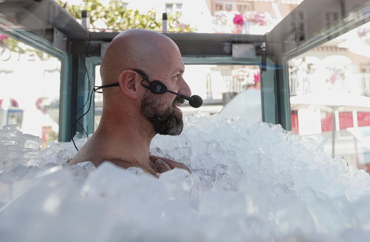 Austrian breaks record for standing in box of ice