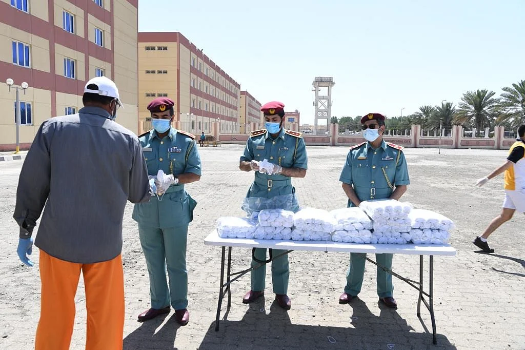 Coronavirus: Masks made by inmates distributed to Abu Dhabi workers ...