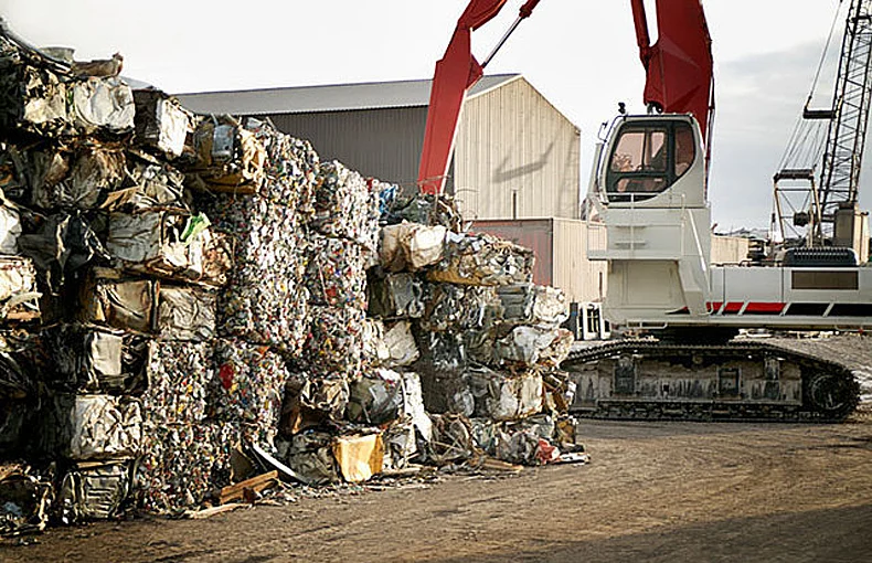 Man crushed to death after falling into trash compactor