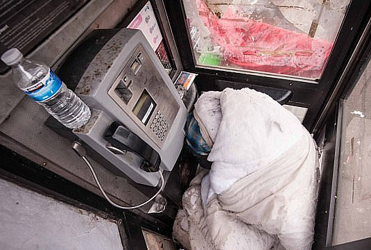 Homeless man sleeps in phone booth fearing zombies | Khaleej Times