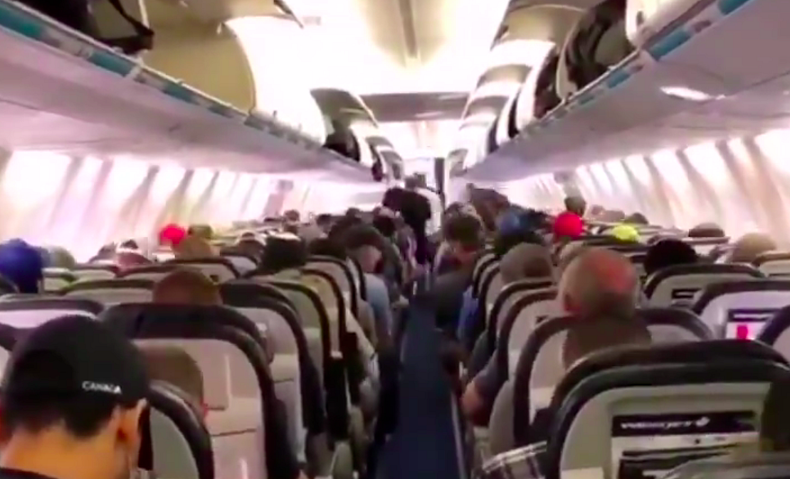 Passengers seen waiting to get off a plane show exactly how it should ...