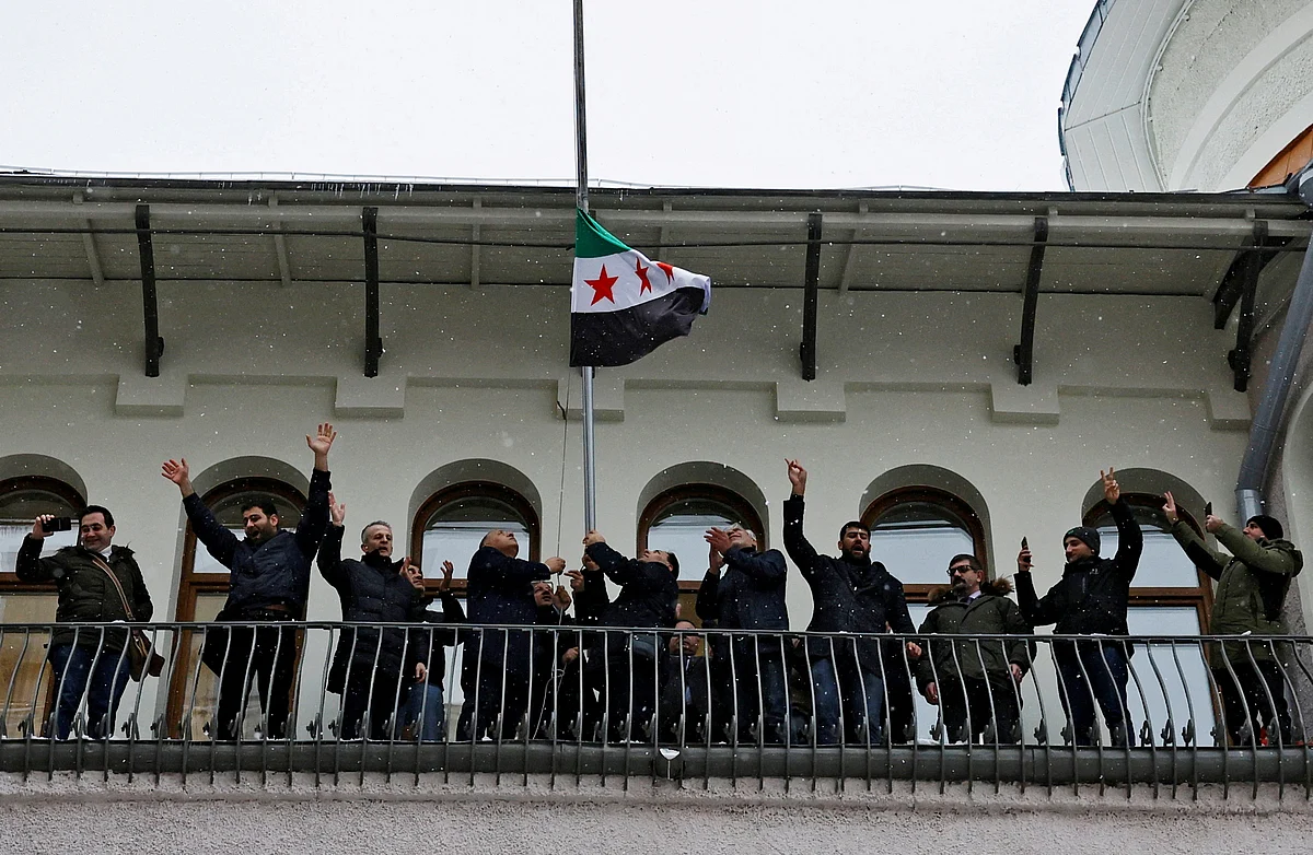 Look: Syrian opposition raises its flag outside embassy in Moscow after ...