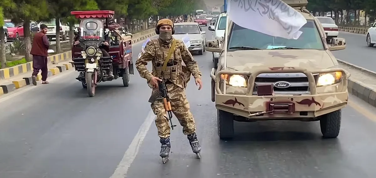 Viral video: Taliban forces go rollerblading while carrying rifles on ...