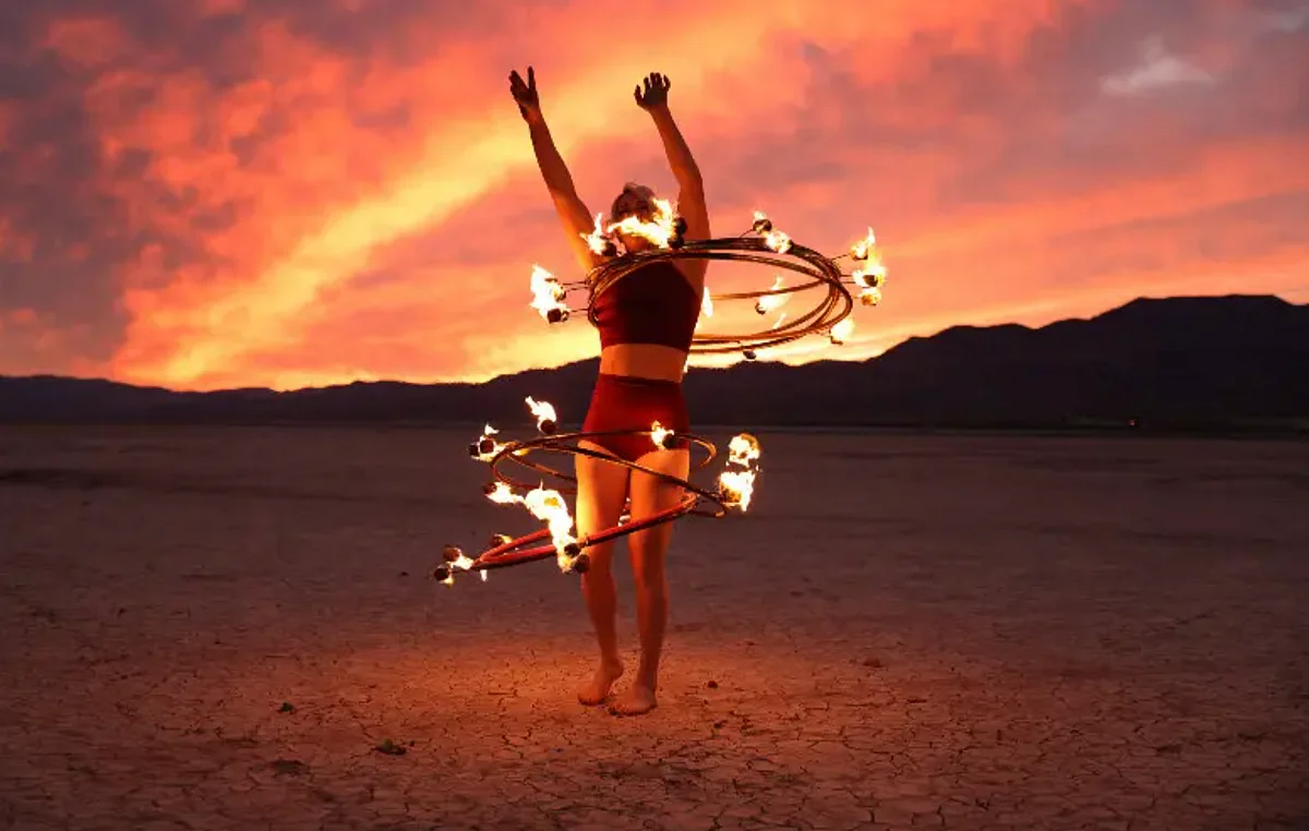Woman spins 8 hula hoops on fire simultaneously to break Guinness World ...