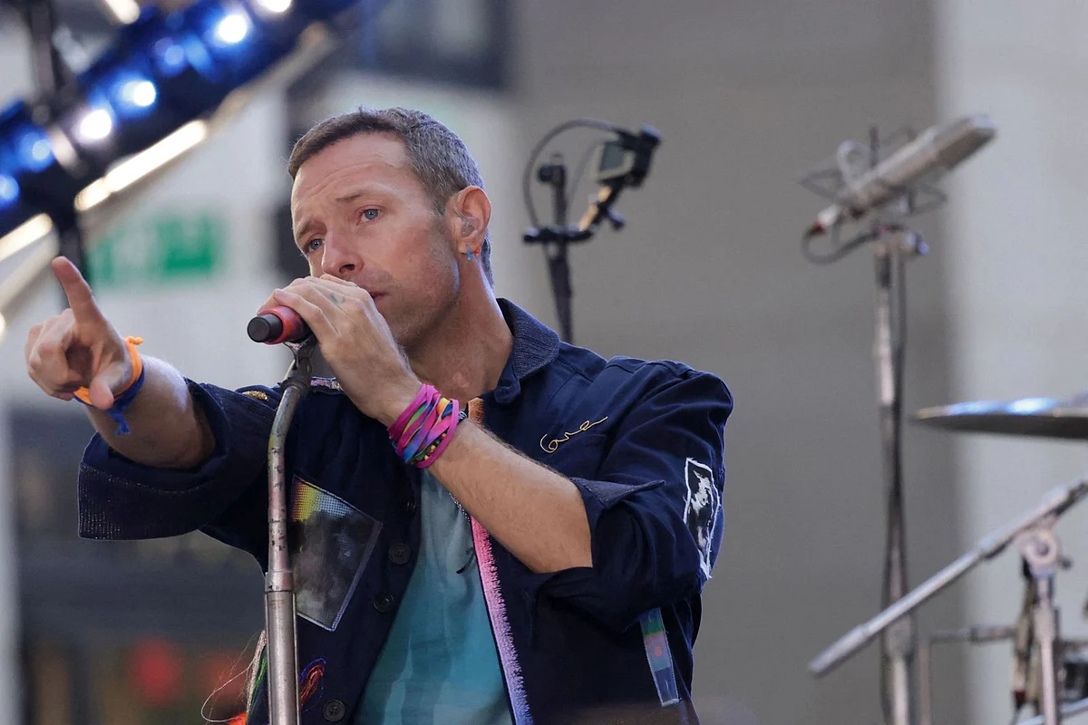Chris Martin falls through stage trap door while performing with ...