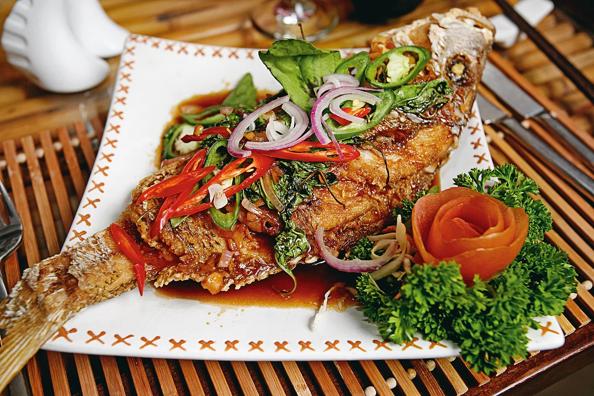 Pla kapong kimao (deep fried fish with garlic sauce) | Khaleej Times