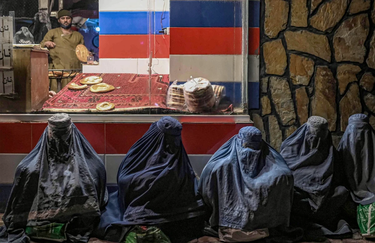 Afghanistan's religious police issue posters ordering women to cover up ...